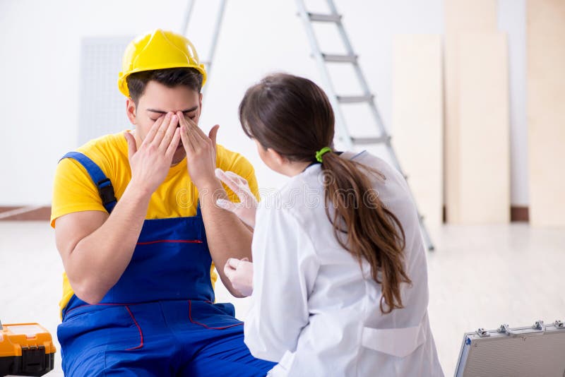 The Doctor Helping Injured Worker at Construction Site Stock Photo ...