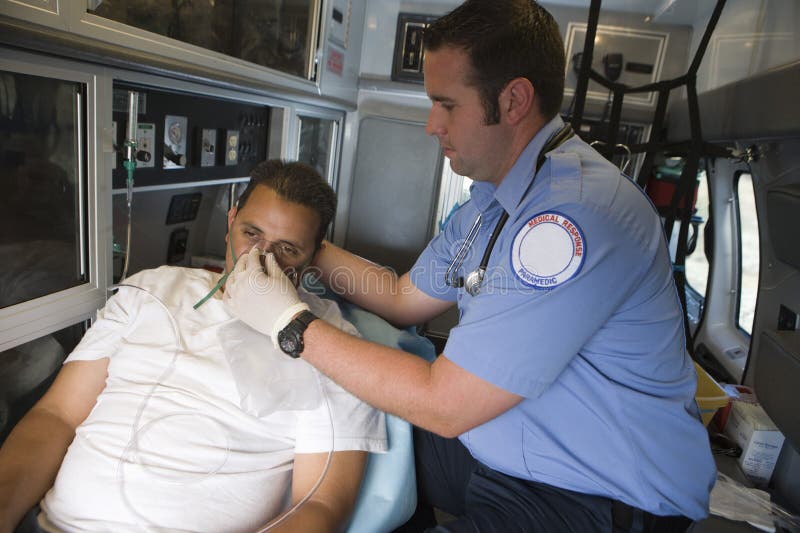 Doctor Helping Man with Oxygen Mask Stock Image - Image of looking ...
