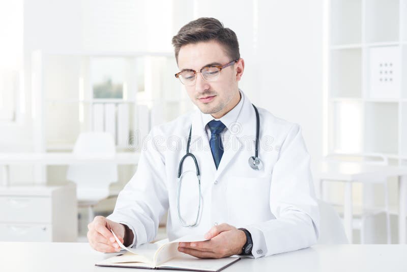 Doctor and his notebook stock image. Image of person - 64985335