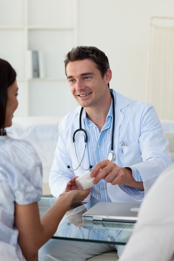 A Doctor and His Patient during a Visit Stock Photo - Image of desk ...
