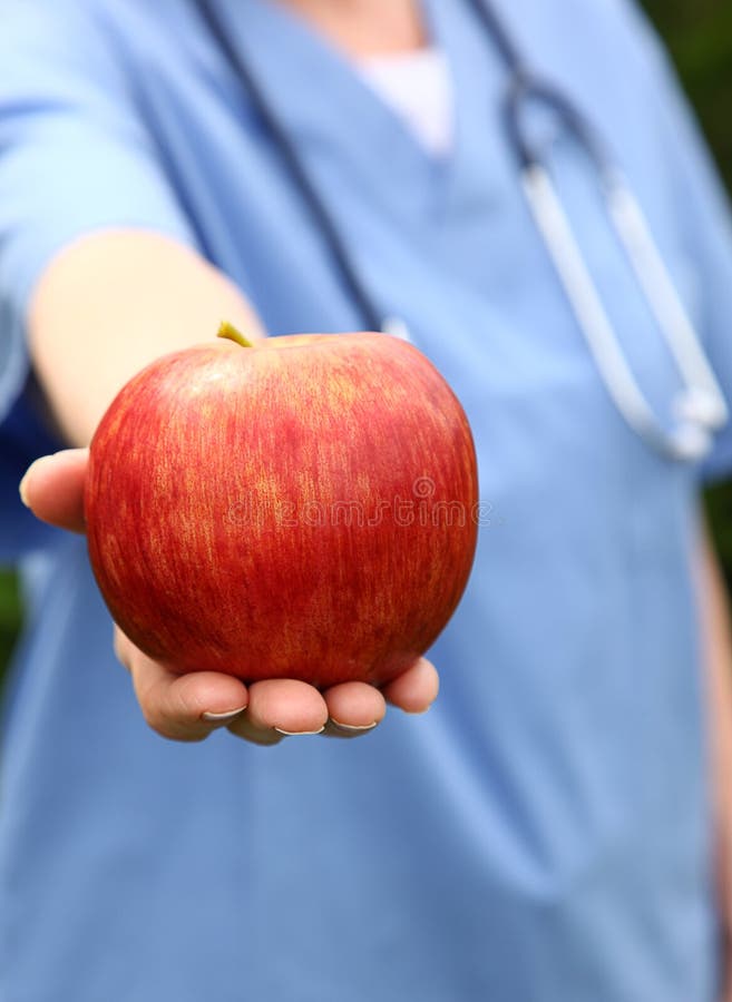 Doctor Holding Apple stock image. Image of hand, metaphor - 19796393