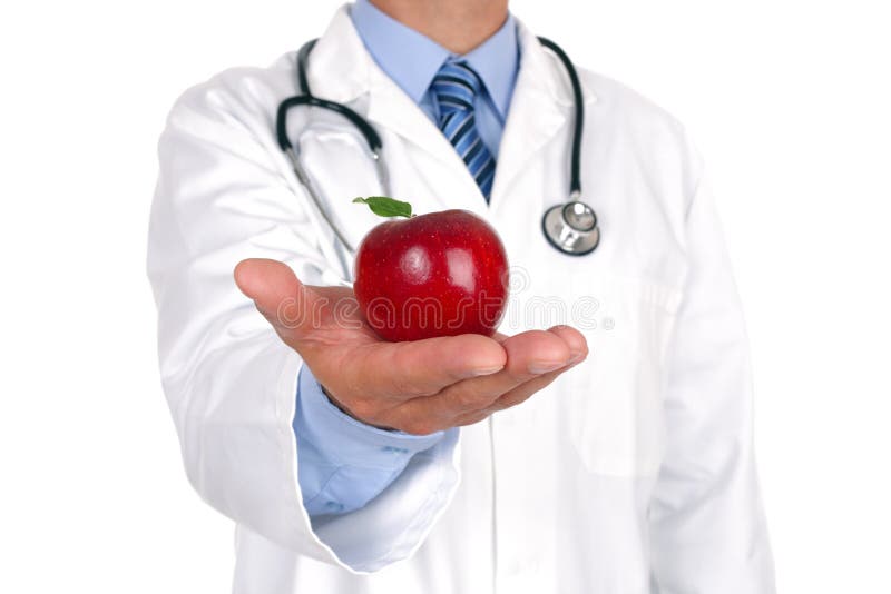 Doctor holding apple stock image. Image of giving, eating - 26776925