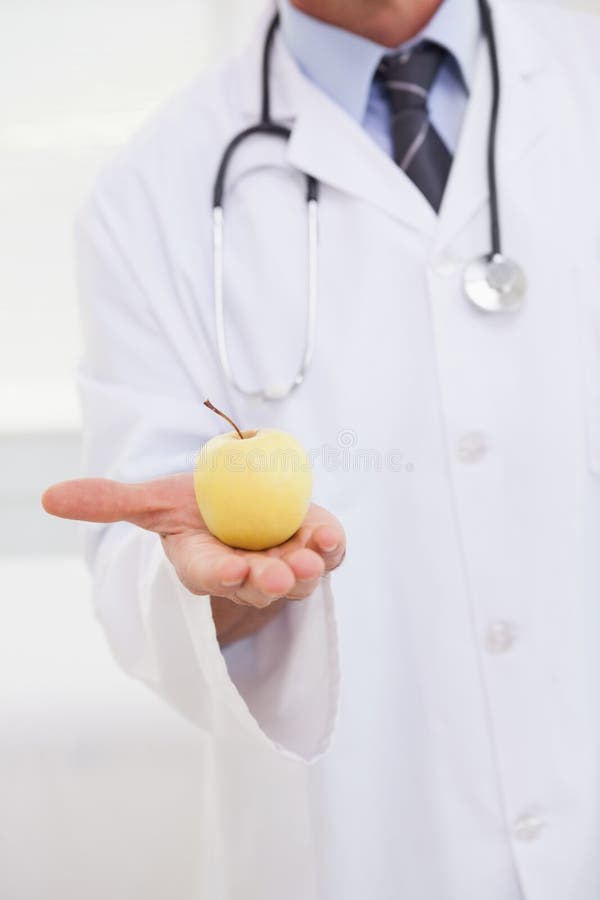 Doctor Holding an Apple in His Hand Stock Image - Image of adult ...