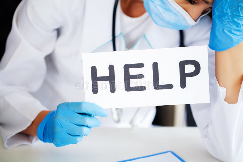 The Doctor is Holding a Card with the Help Symbol in the Office of the ...