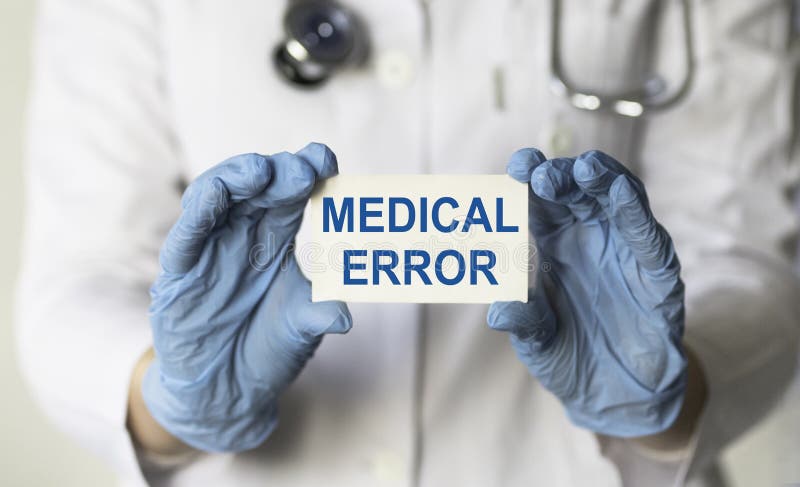Doctor Holding a Card with Medical Error Sign Stock Photo - Image of ...