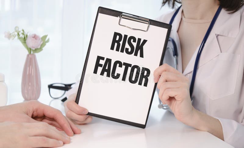 Doctor Holding a Card with Text RISK FACTOR. Stock Photo - Image of ...