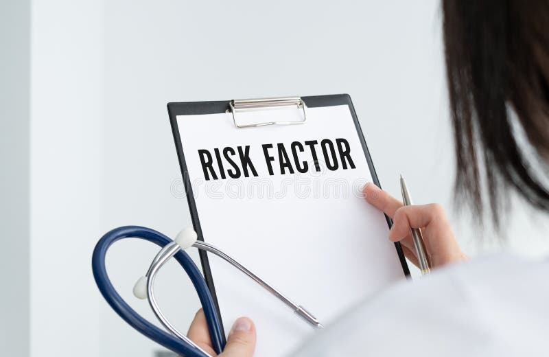 Doctor Holding a Card with Text RISK FACTOR, Medical Concept Stock ...
