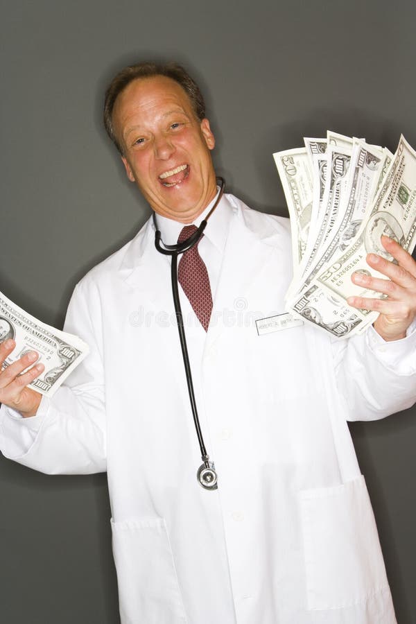 Doctor holding cash stock image. Image of thrilled, cash - 5646145