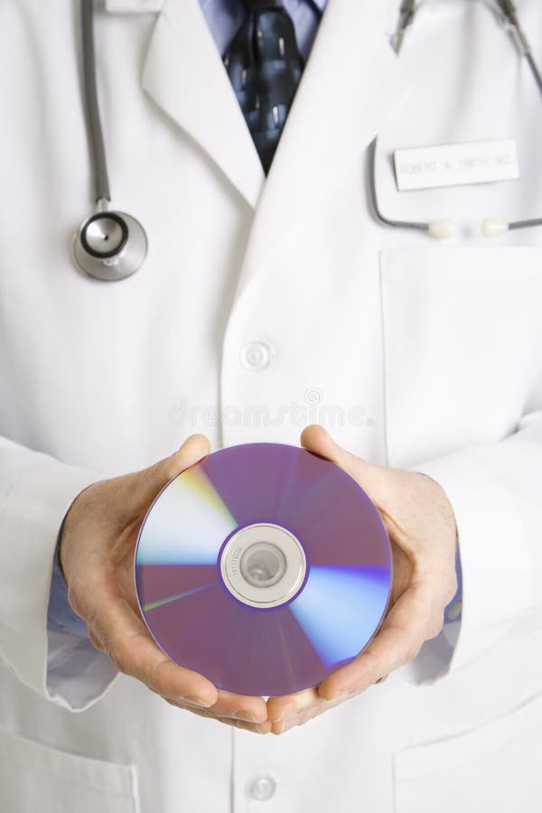 Doctor Holding Compact Disc. Stock Image - Image of years, caucasian ...