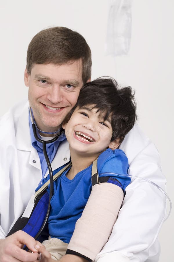 Doctor Holding a Disabled Little Boy Stock Image - Image of doctor ...
