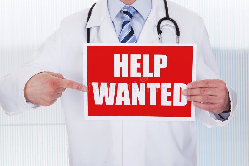 Healthcare Professional Holding Up Help Wanted Sign Stock Photos - Free ...