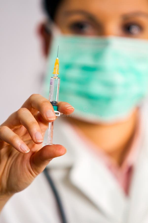 Doctor holding injection stock image. Image of background - 29592993