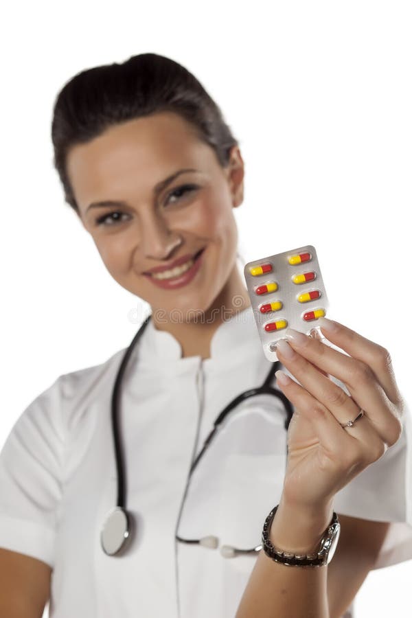 Doctor holding pills stock photo. Image of happy, medication - 90341994