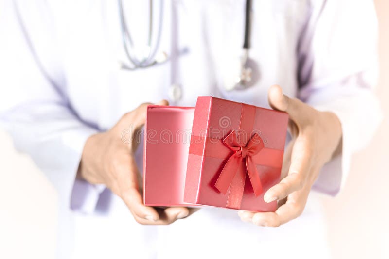 Doctor Holding the Red Gift Box in His Hand Stock Image - Image of ...