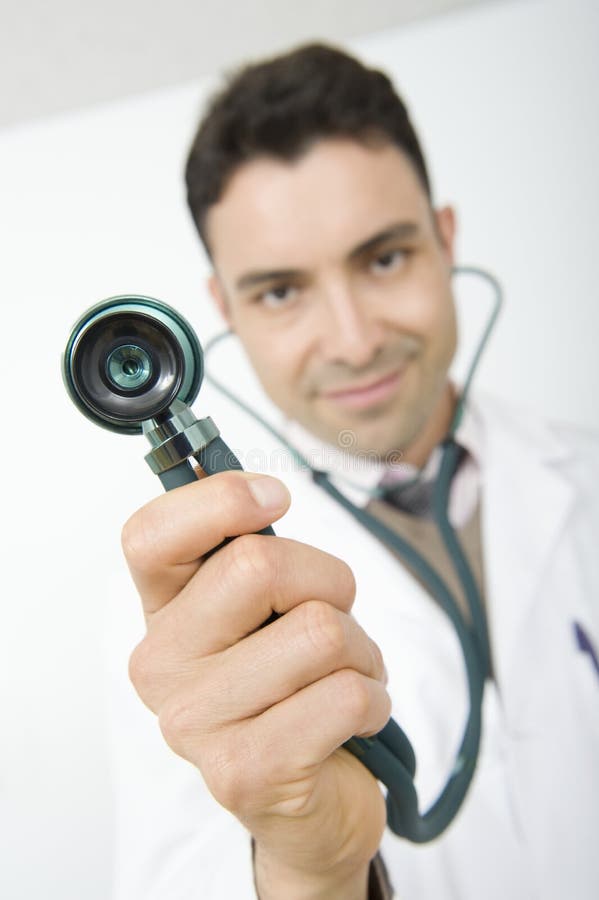 Doctor Holding Stethoscope stock photo. Image of expertise - 29666120