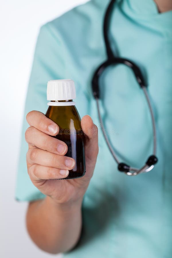 Doctor holding a syrup stock image. Image of practice - 43848453
