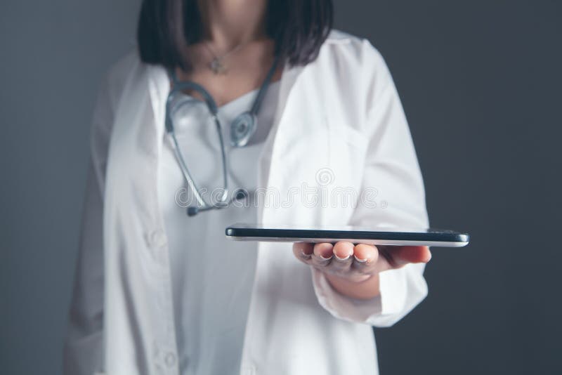Doctor holding a tablet stock photo. Image of hand, modern - 237808796