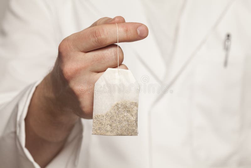 Doctor holding tea bag stock image. Image of drinking - 53085079