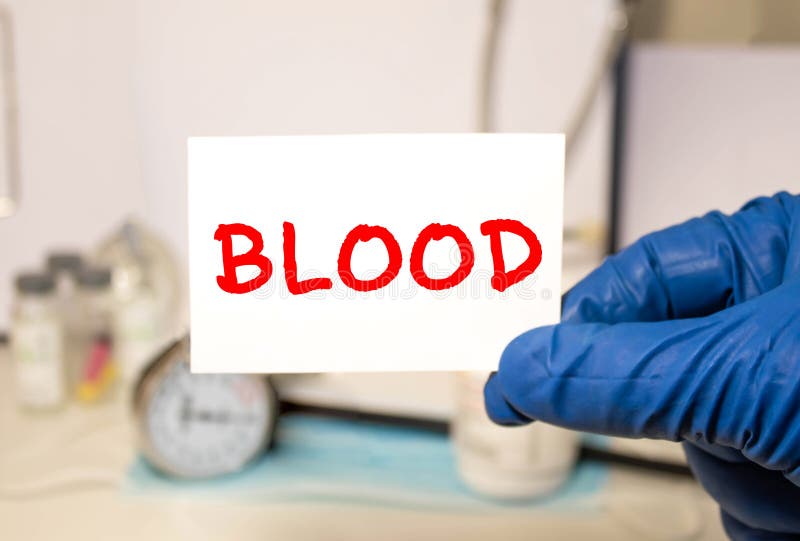The Doctor Holds a Card with the Text BLOOD. Medical Concept Stock ...