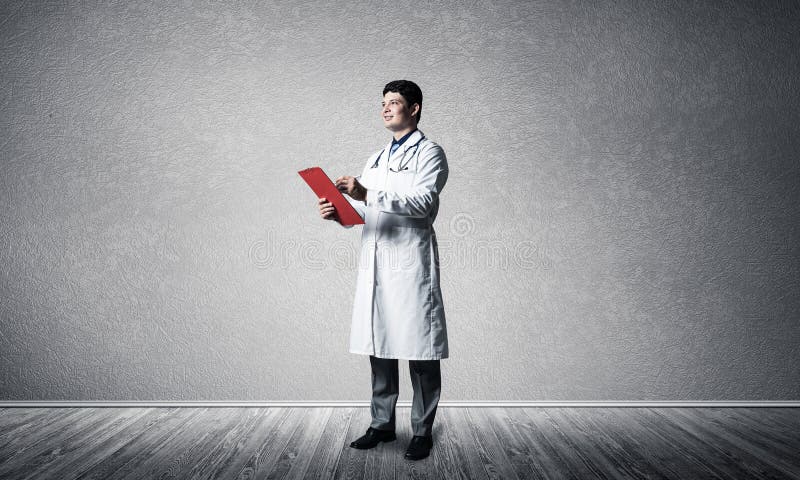 The Doctor Holds a Red Tablet for Documents in Front of Him Stock Photo ...