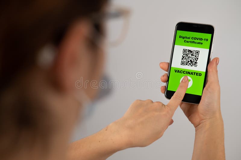 The Doctor Holds a Smartphone with a QR Code about the Vaccination ...