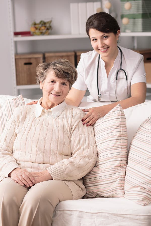Doctor during home visit stock image. Image of senior - 63805411