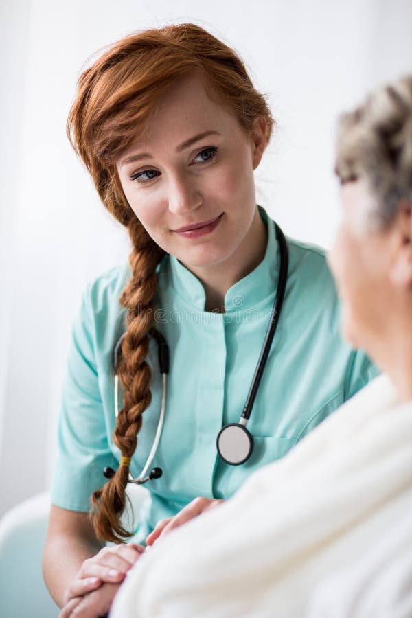 Doctor during home visit stock image. Image of patient - 61417455