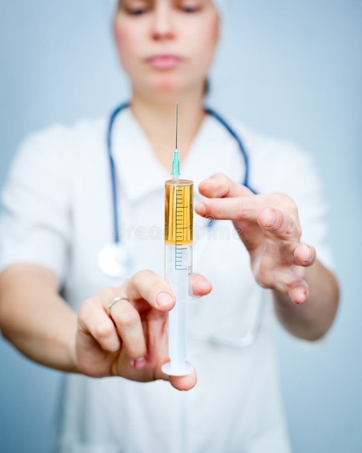 Doctor with huge syringe stock photo. Image of infection - 24089386