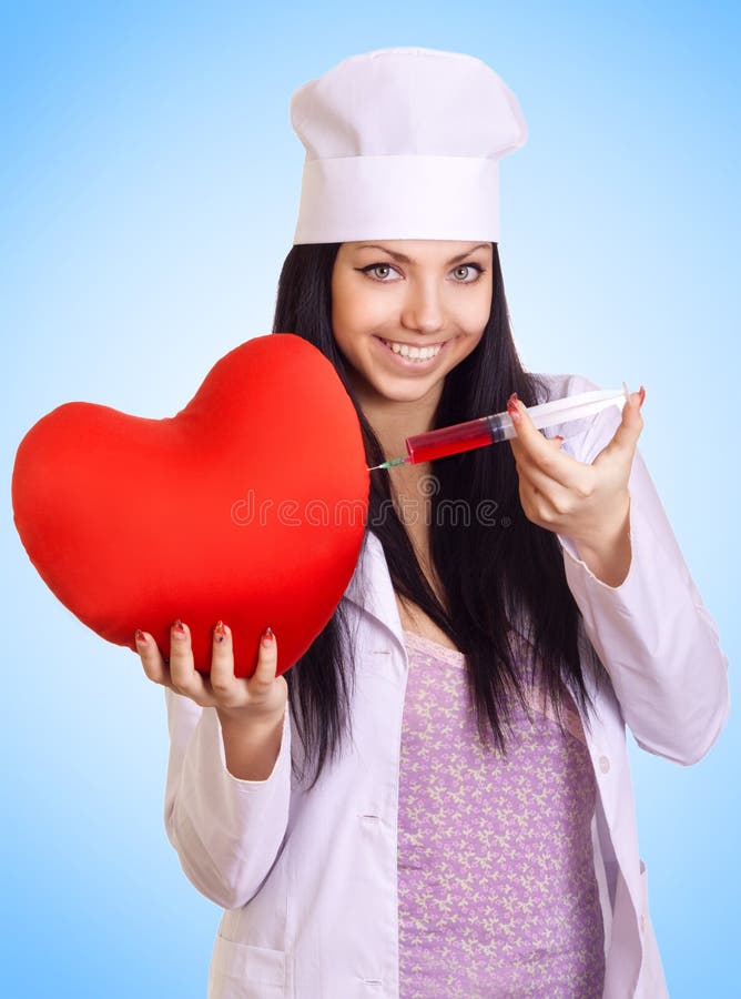Doctor Inject A Syringe Into The Red Heart Stock Photo - Image of ...