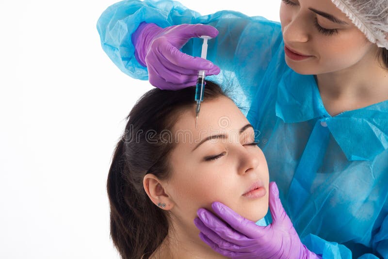 Doctor injects a botox stock photo. Image of injecting - 82765542