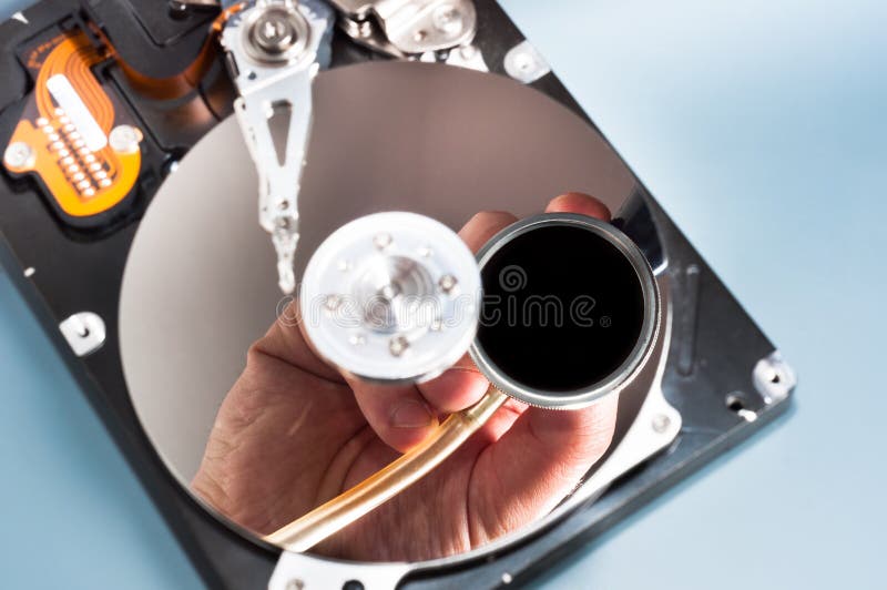 Doctor inspecting bad hdd stock image. Image of harddrive - 19710103