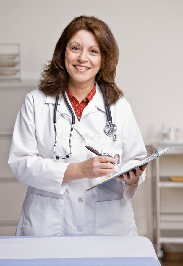 Doctor in Lab Coat Holding Medical Chart Stock Photo - Image of person ...