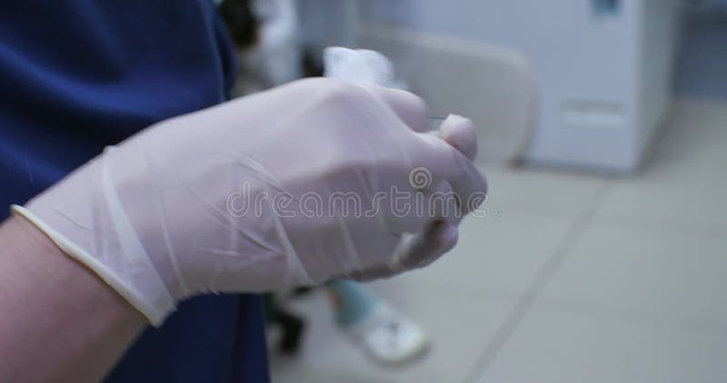 A Doctor in a Laboratory Wipes a Glass Slide before Performing an ...