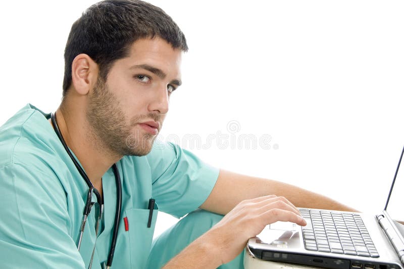 Doctor in Scrubs Using Computer at Hospital Desk Stock Image - Image of ...