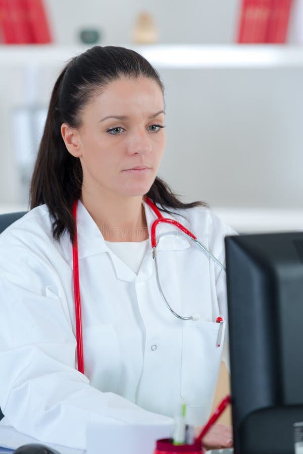 Doctor with Laptop Writing in Doctors Offic Stock Image - Image of ...