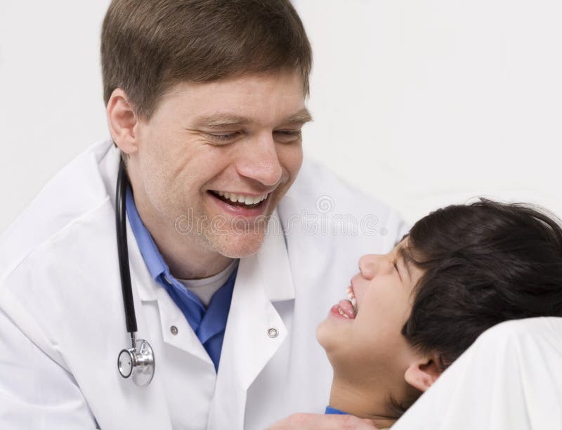 Doctor Laughing with Little Boy in Hospital Stock Photo - Image of ...
