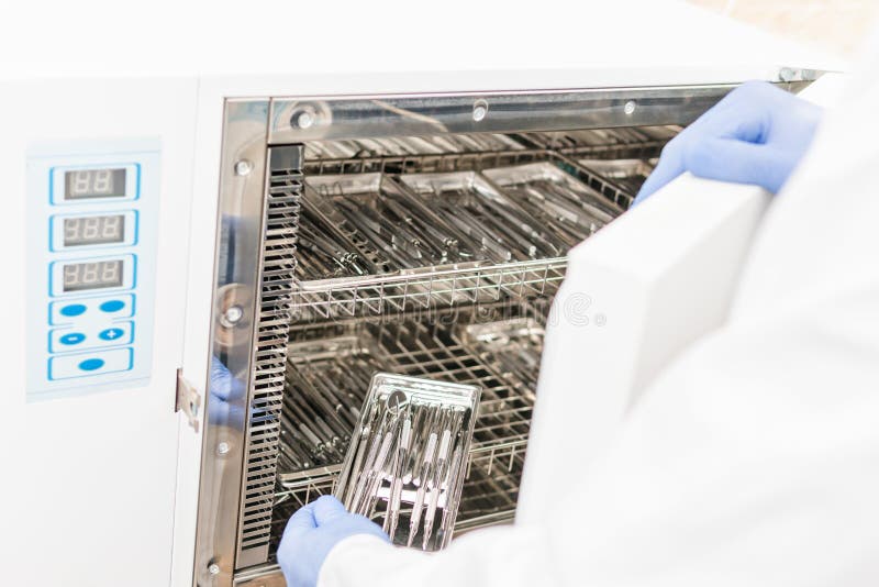 Doctor Loads the Instruments into Sterilizer Stock Image - Image of ...