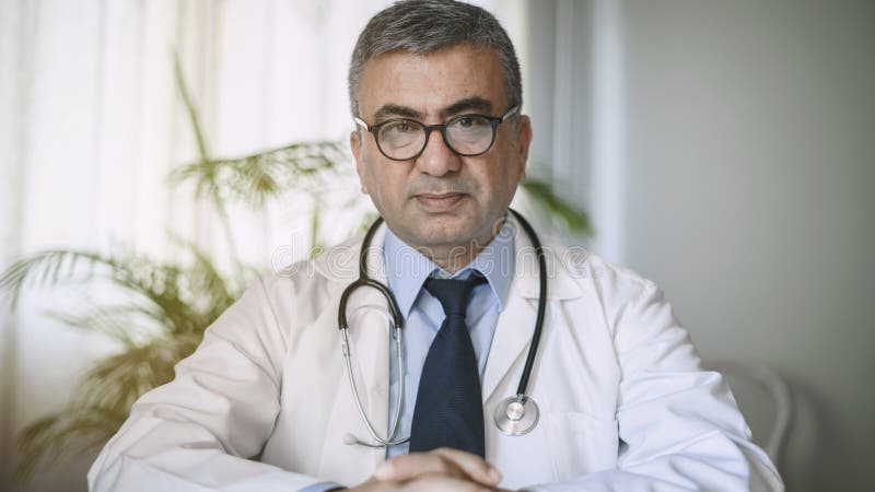 Doctor Looking at the Camera Stock Photo - Image of healthcare, happy ...