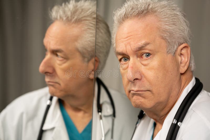 Doctor Looking at Camera with Reflection in Mirror Stock Image - Image ...