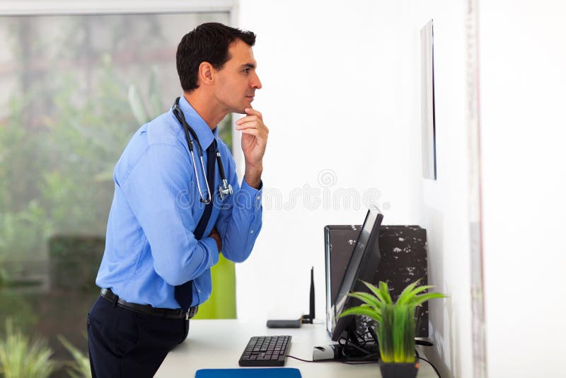 Doctor looking chart stock photo. Image of modern, caucasian - 30689704