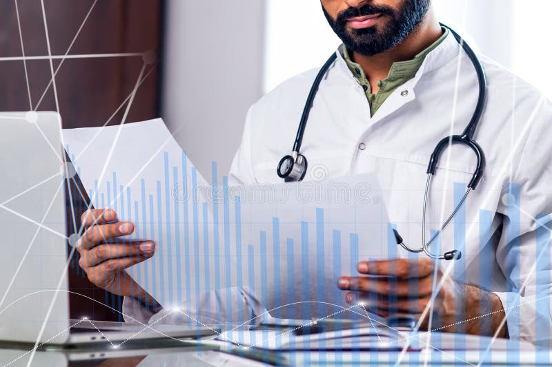 A Doctor is Looking at a Computer Screen with a Graph on it Stock Image ...