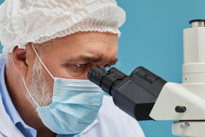 Doctor Looking through the Microscope Stock Image - Image of medicine ...