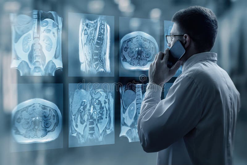 Doctor Looking at X-rays on a Virtual Computer Screen Stock ...
