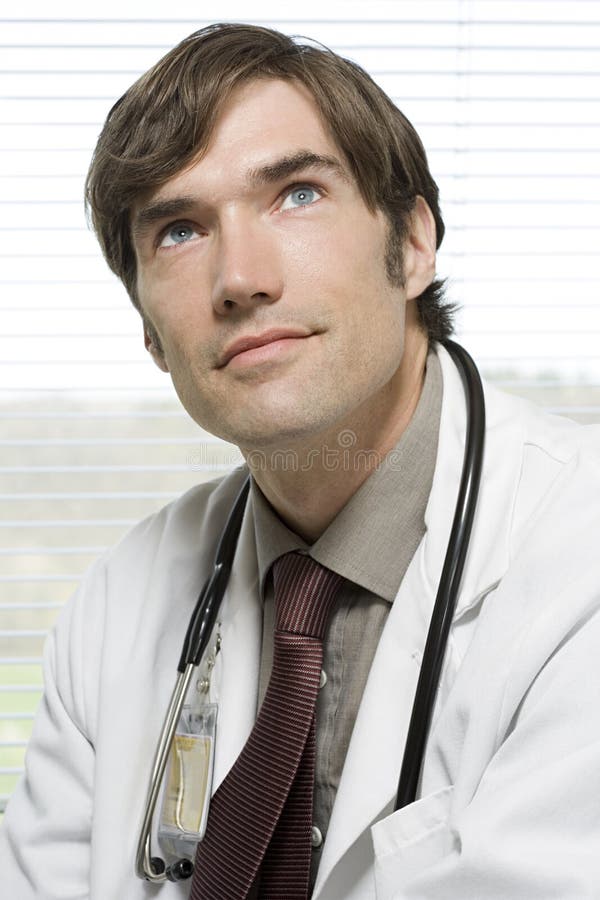 Doctor looking up stock image. Image of front, healthcare - 62561711