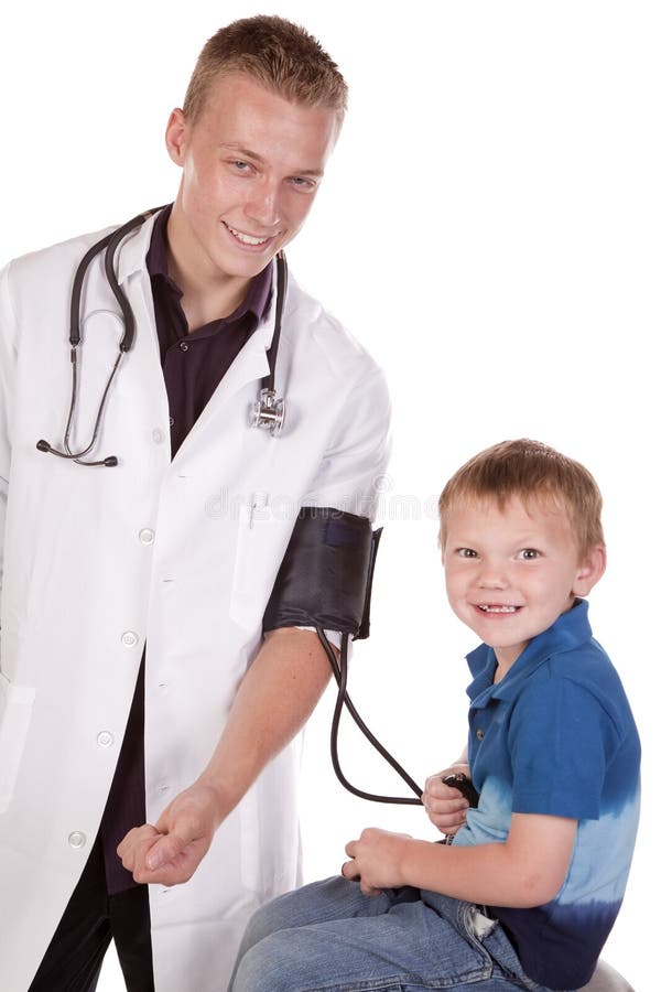 Doctor making boy happy stock image. Image of doctor - 16195091