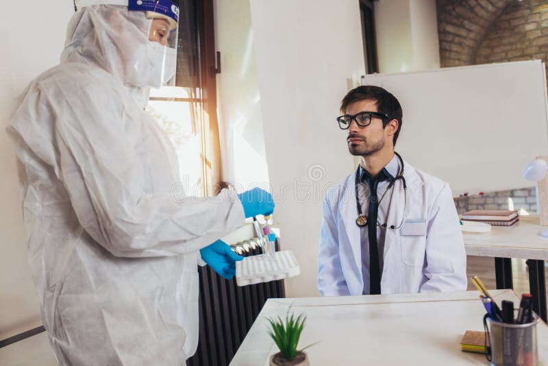 Doctor Making Covid-19 PCR Test for Her Colleague in Office Stock Photo ...