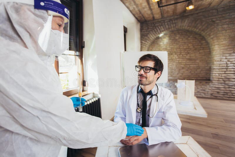 Doctor Making Covid-19 PCR Test for Her Colleague in Office Stock Photo ...