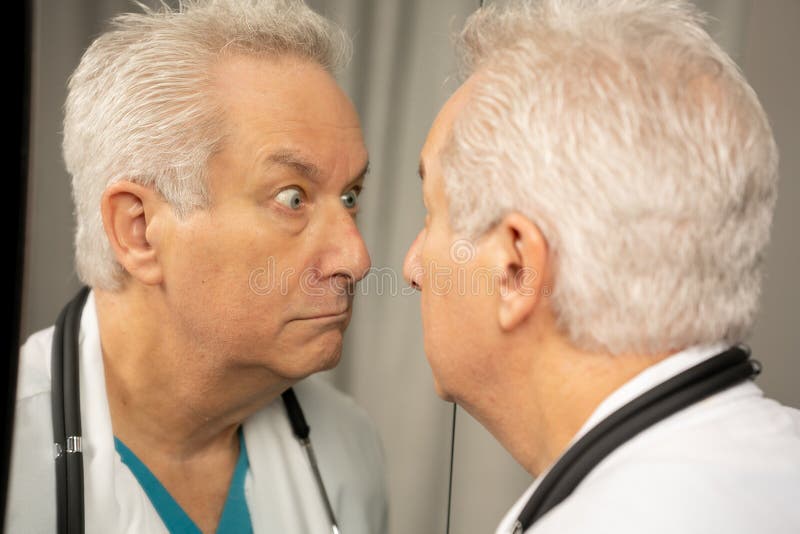 Doctor Making Funny Faces in the Mirror Stock Image - Image of ...
