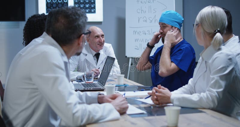 Doctor Making His Colleagues Laugh with Story Stock Image - Image of ...