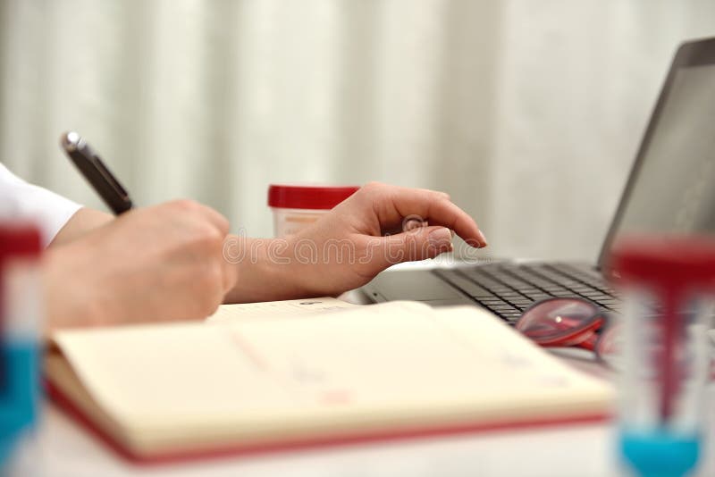 Doctor Making Notes in Diary Stock Photo - Image of doctor, clinical ...